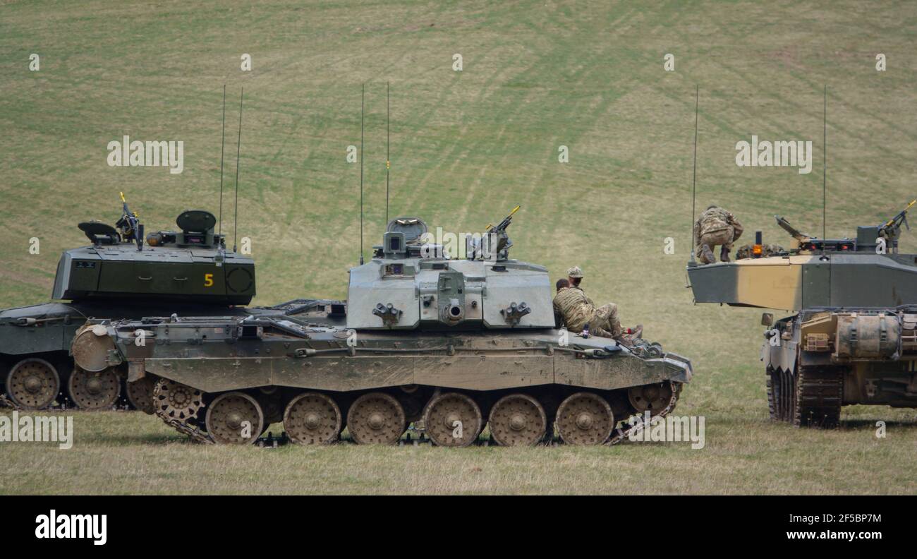 the crews of four British Army Challenger 2 main battle tanks take a ...