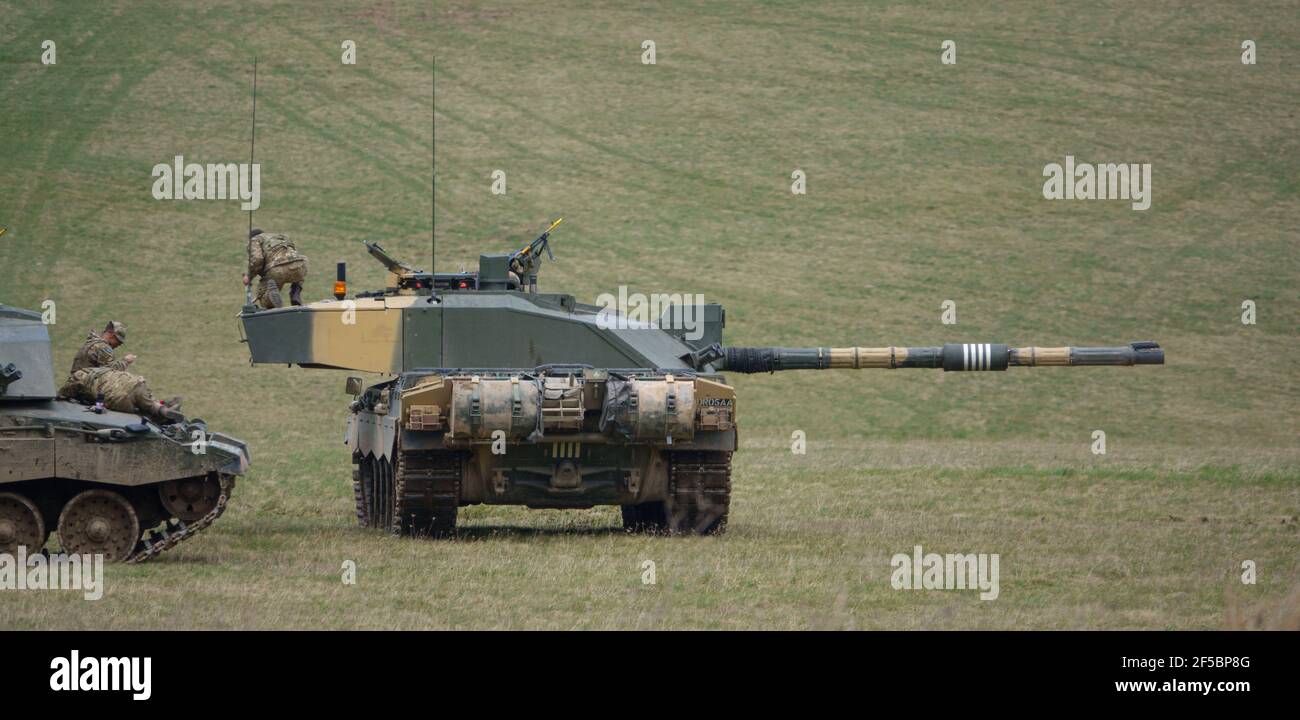 the crews of four British Army Challenger 2 main battle tanks take a ...