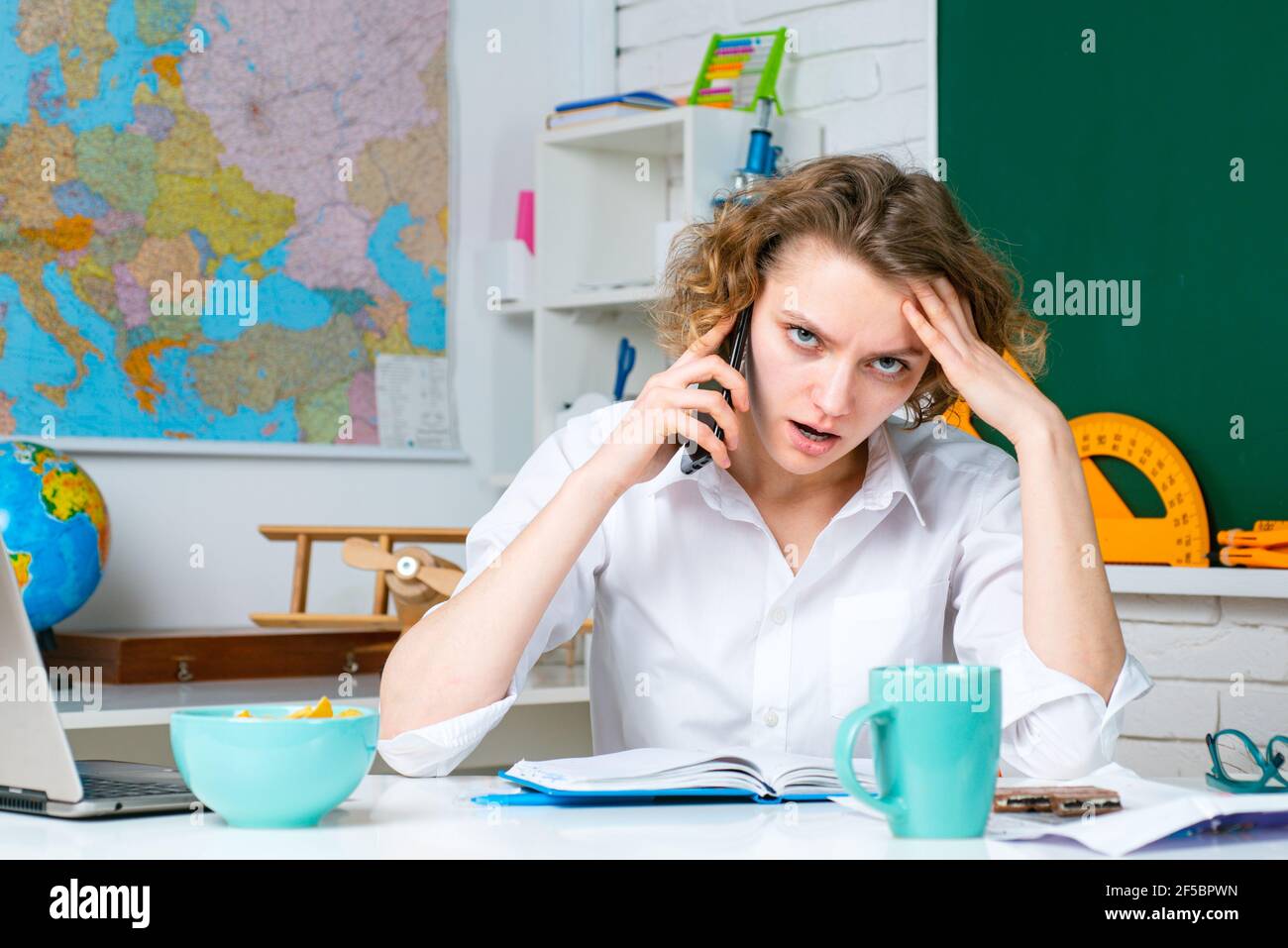 School teacher talking on smartphone. Education concept. Tutor in ...