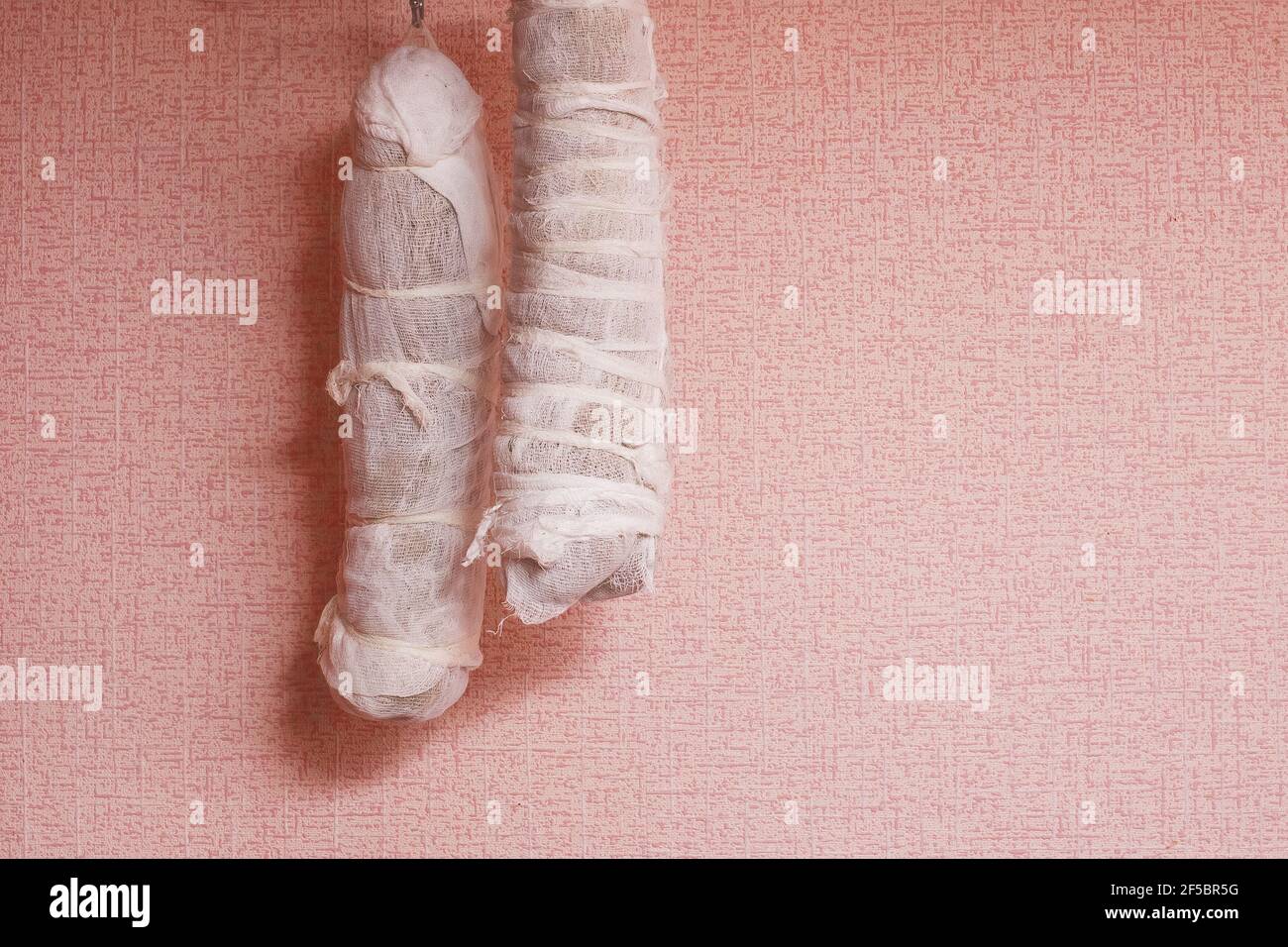 Pork loin, polendwitz wrapped in gauze and hung for drying Stock Photo ...