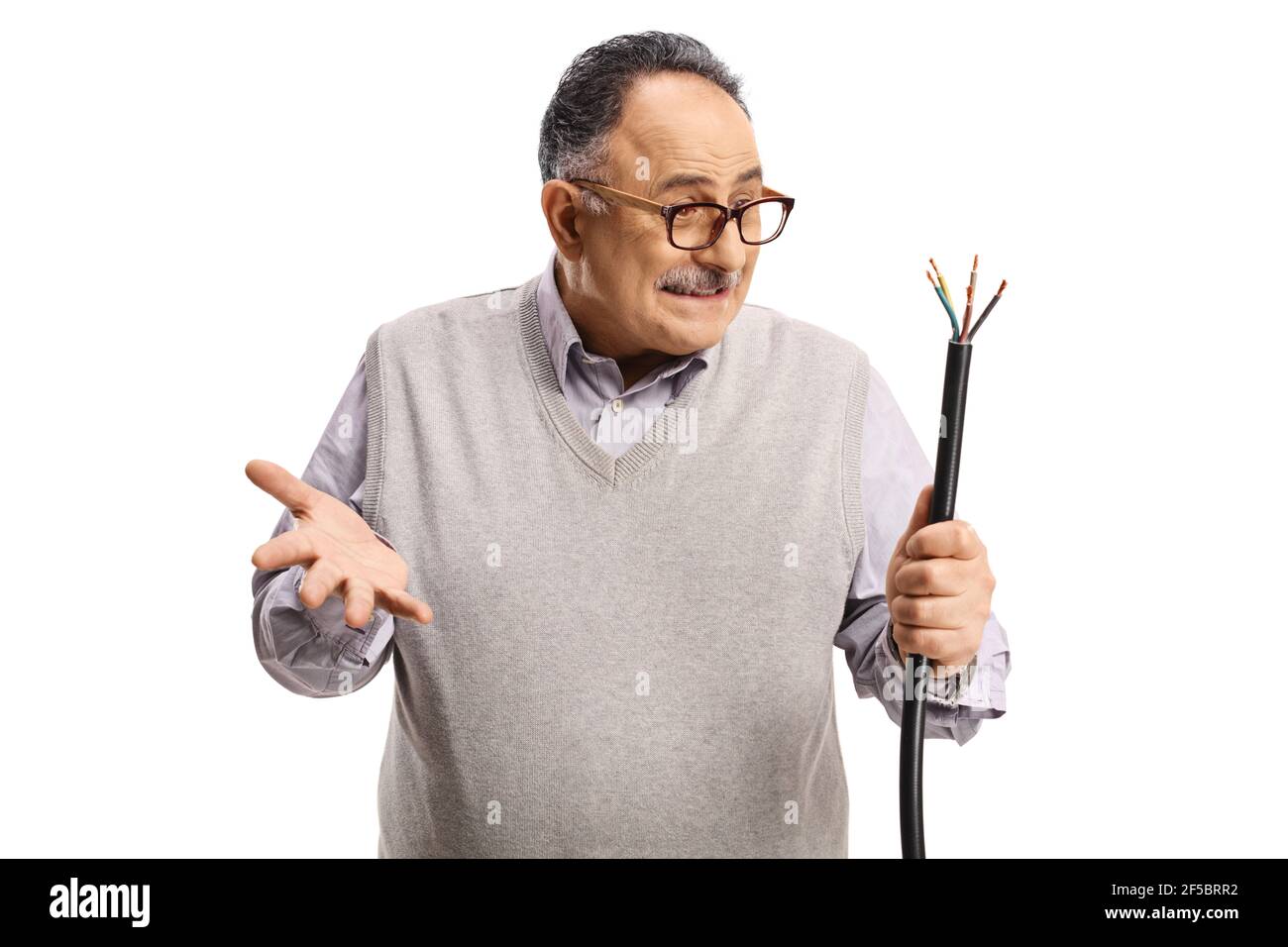 Mature man holding a broken elecrtic cable and gesturing with hand ...