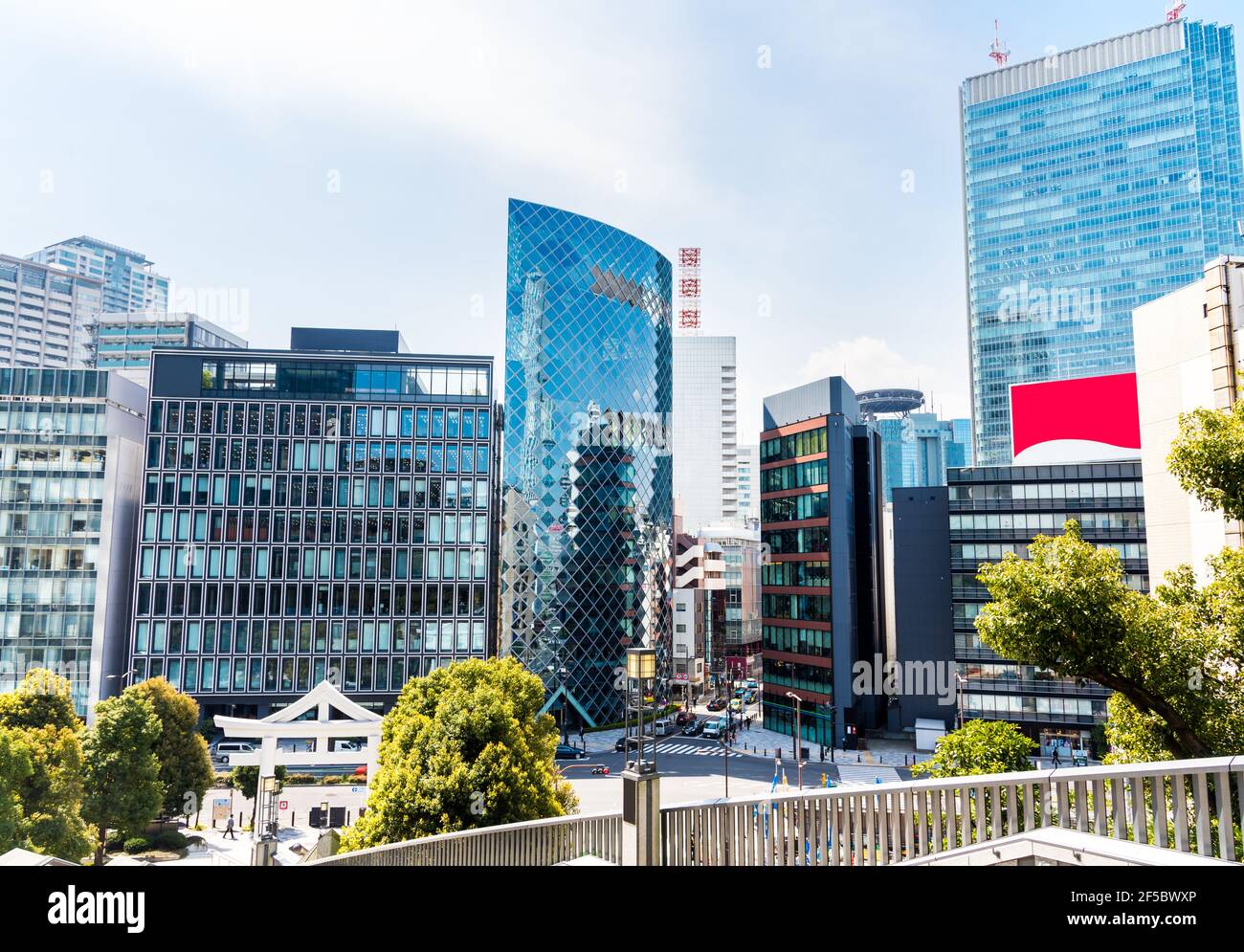Modern glass office buildings on a partly cloudy spring day Stock Photo ...