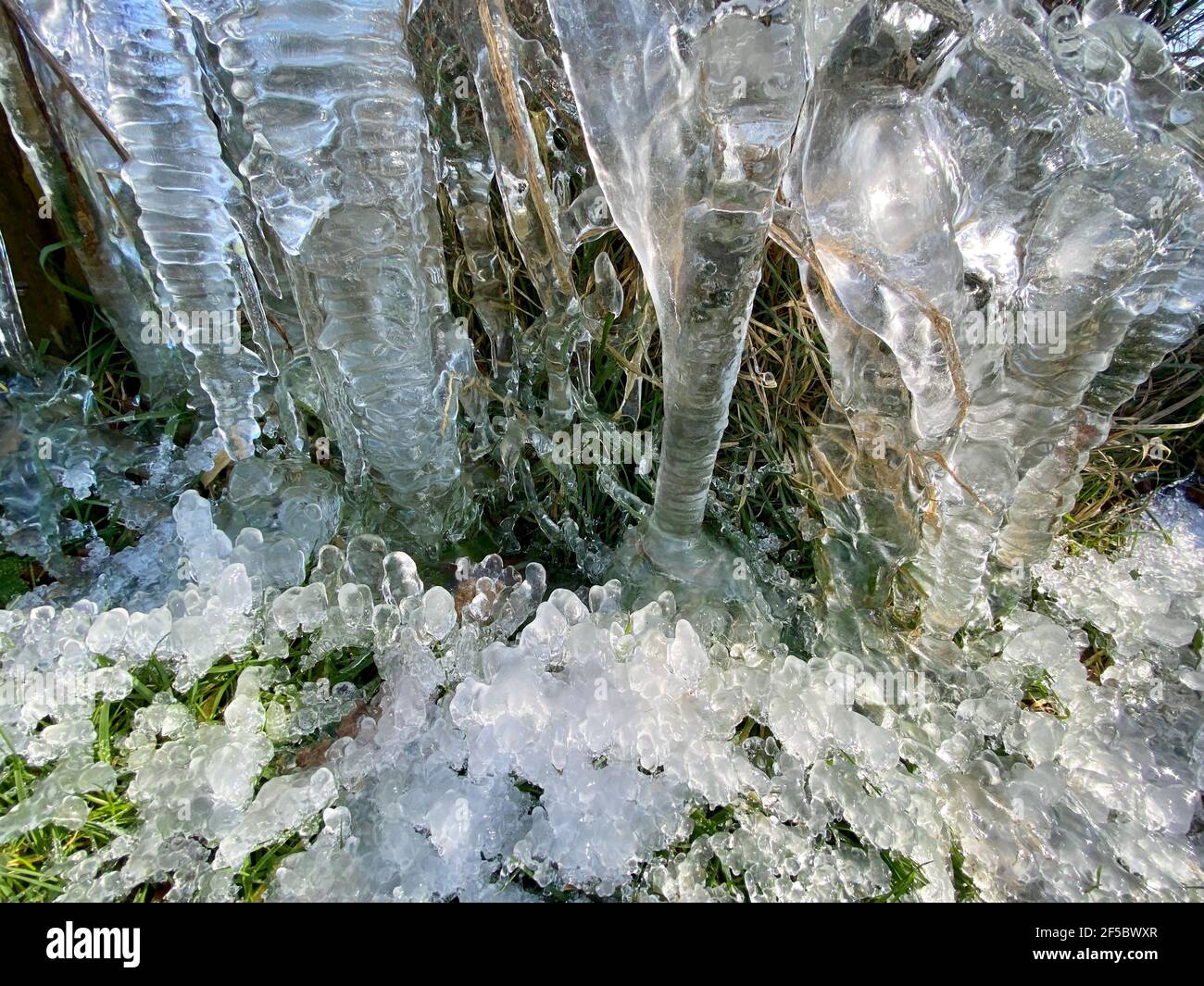 Ice icicle background backdrop with copy space frozen water from tap ...