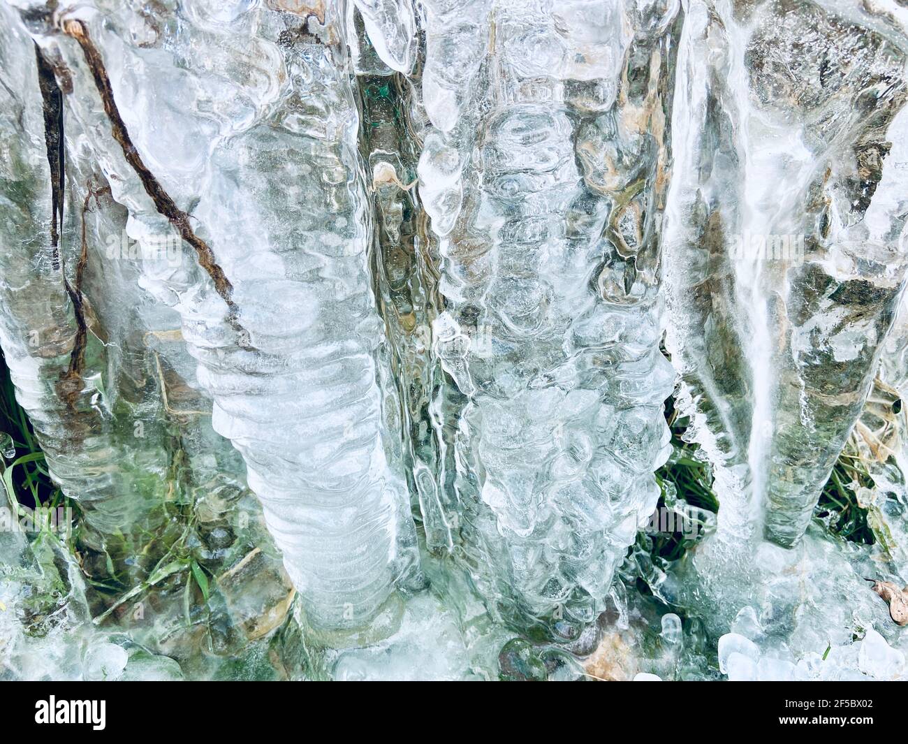Ice icicle background backdrop with copy space frozen water from tap ...