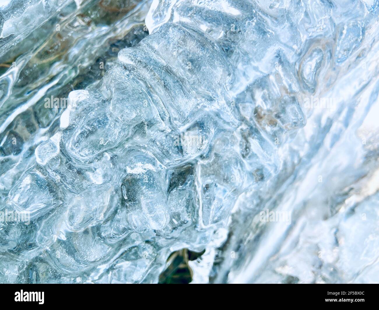 Ice icicle background backdrop with copy space frozen water from tap ...