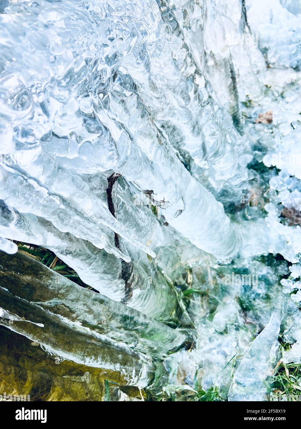 Ice icicle background backdrop with copy space frozen water from tap ...