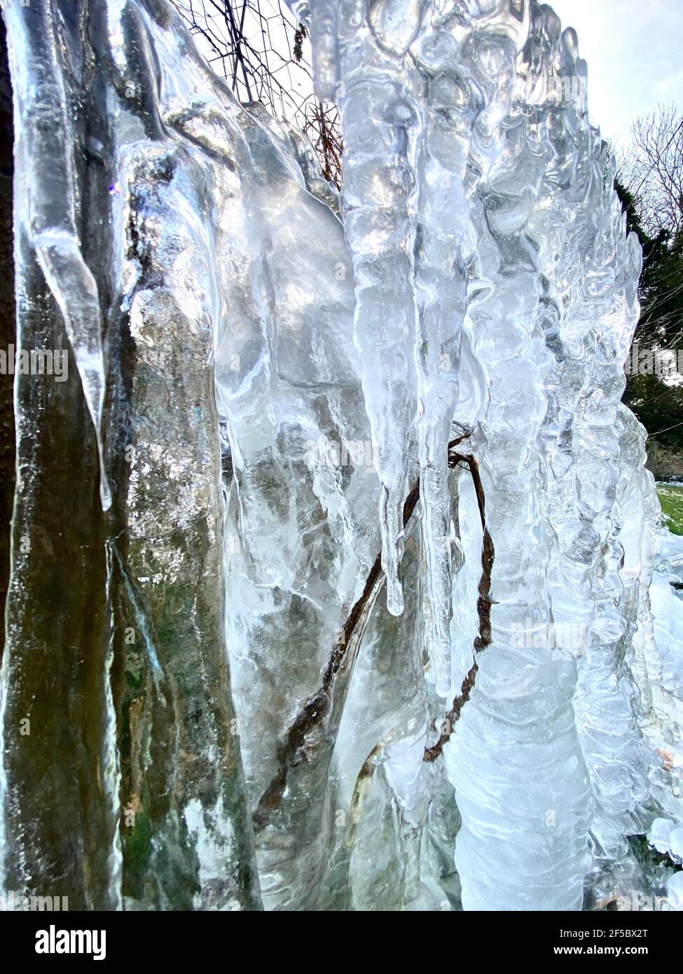 Ice icicle background backdrop with copy space frozen water from tap ...