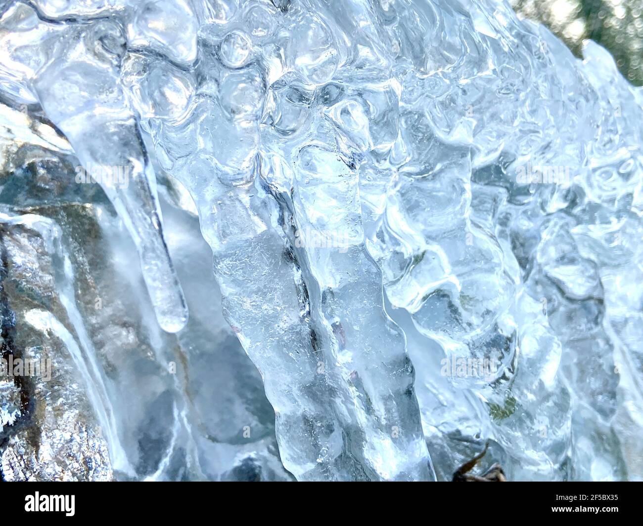 Ice icicle background backdrop with copy space frozen water from tap ...