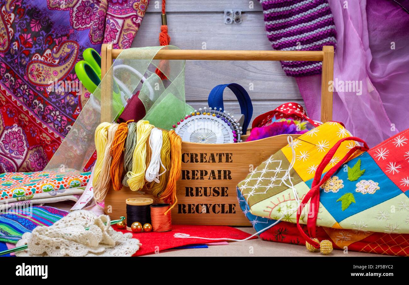 Sewing box with create, repair, reuse and recycle text surrounded by ...
