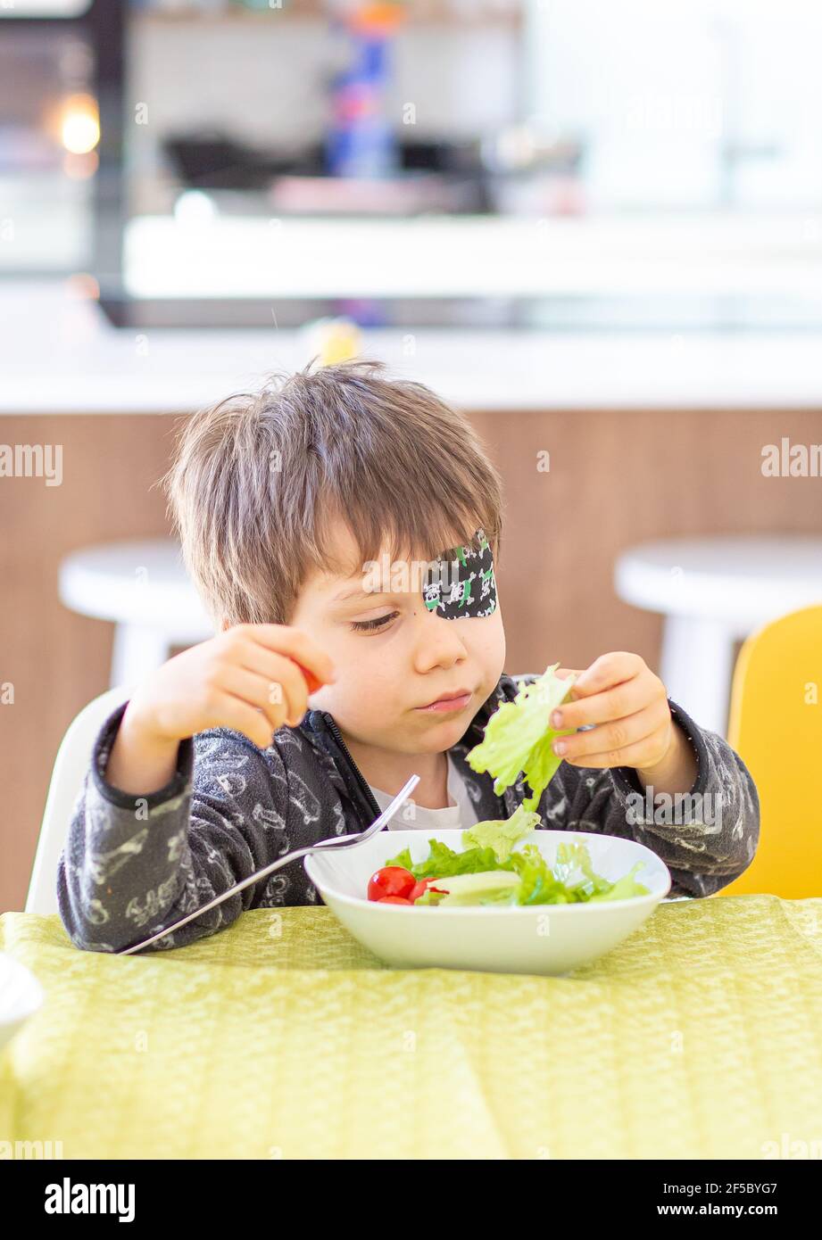 Small kid refusing to eat vegetable salad. Lifestyle Concept Stock ...