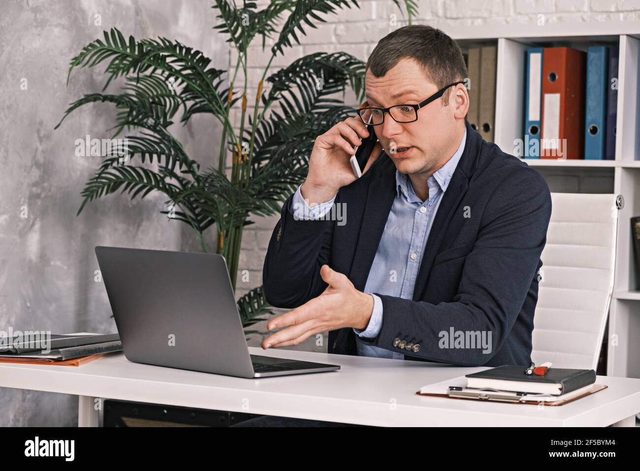 Business people pointing at monitor hi-res stock photography and images ...