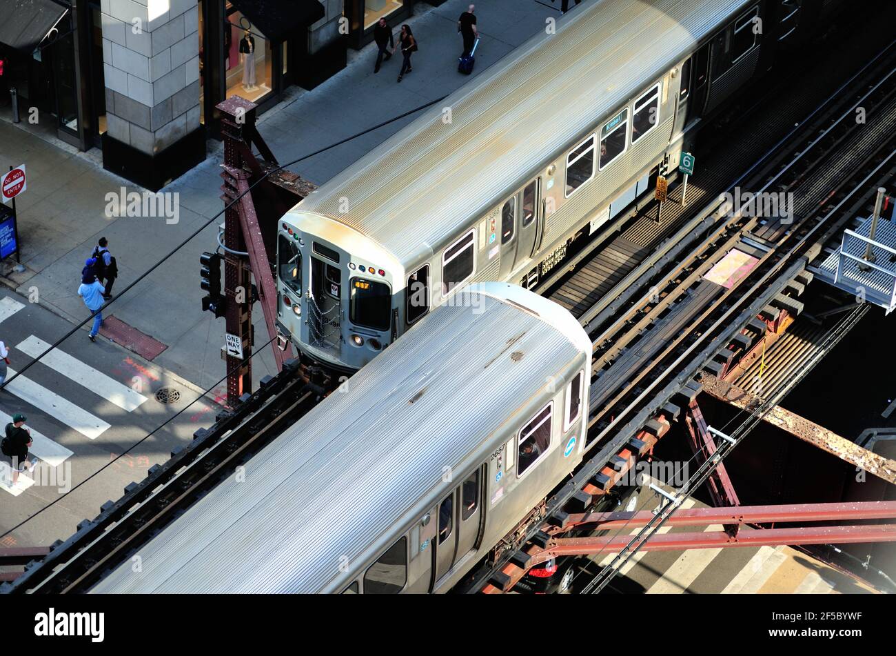 Chicago, Illinois, USA. An elevated view of passing CTA L trains above ...
