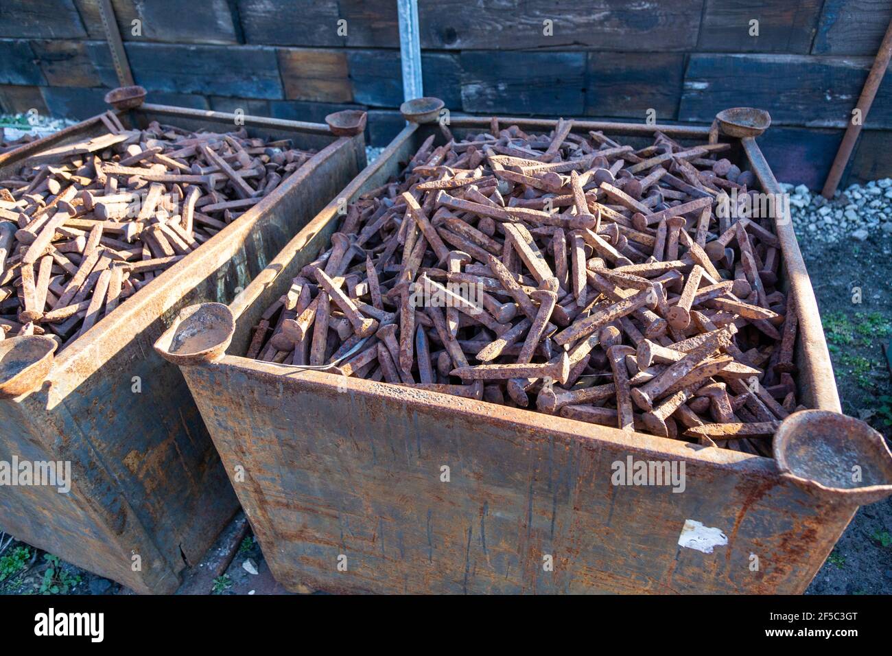 Bins of rusty metal railroad spikes Stock Photo - Alamy