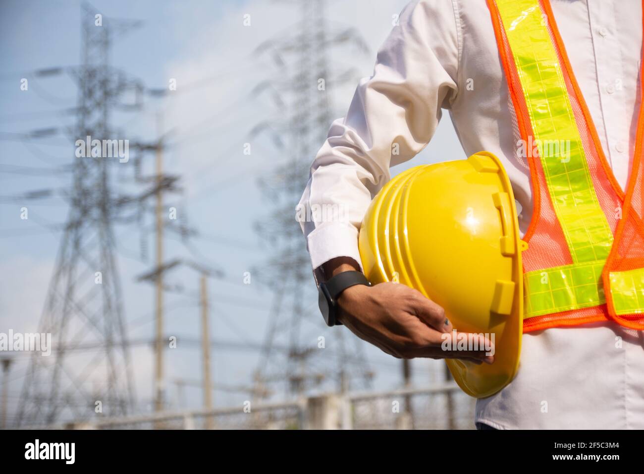 Technician holding Yellow hat safety hard hat sunlight background Stock ...