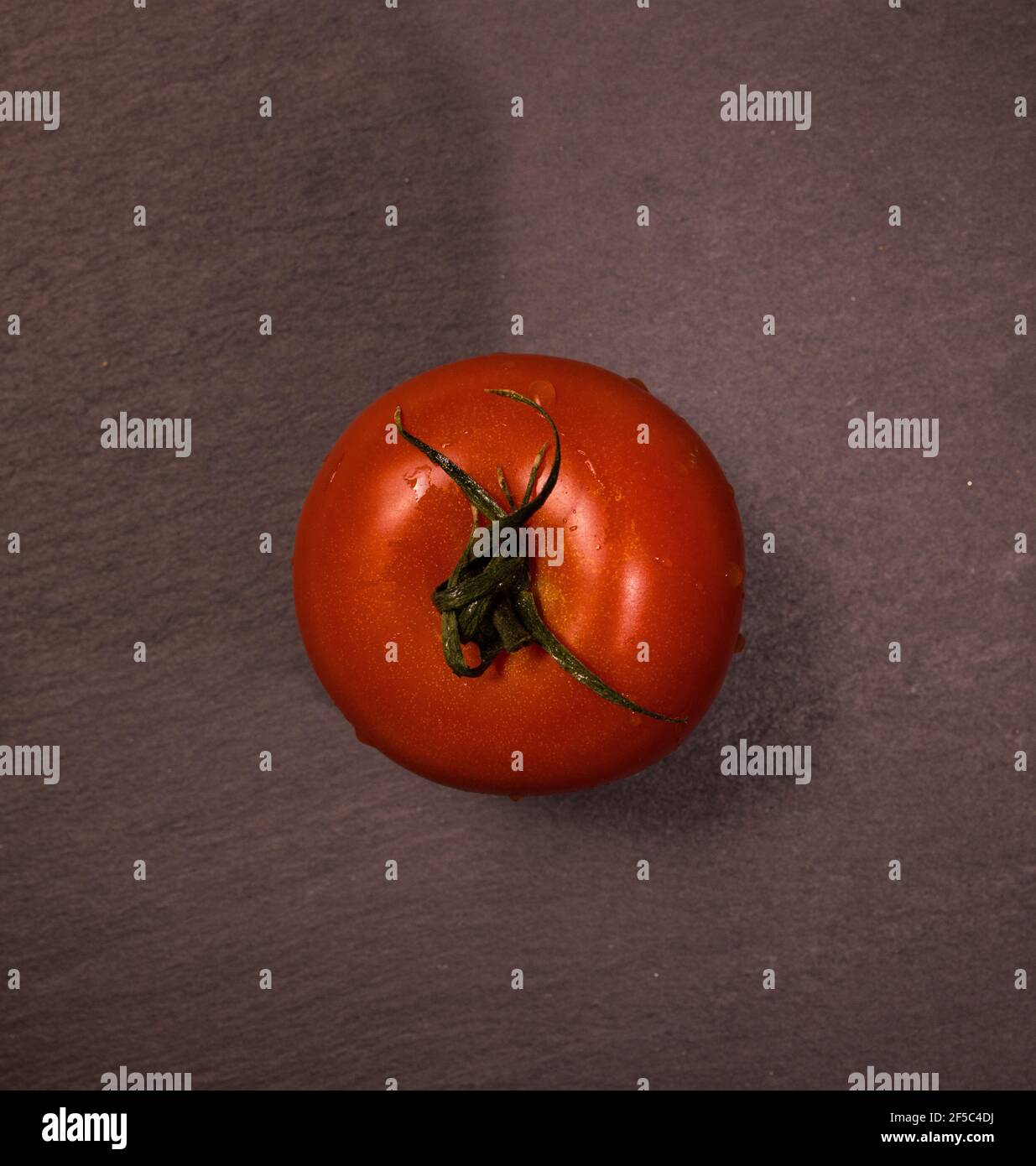 A fresh tomato from above - top down view Stock Photo - Alamy