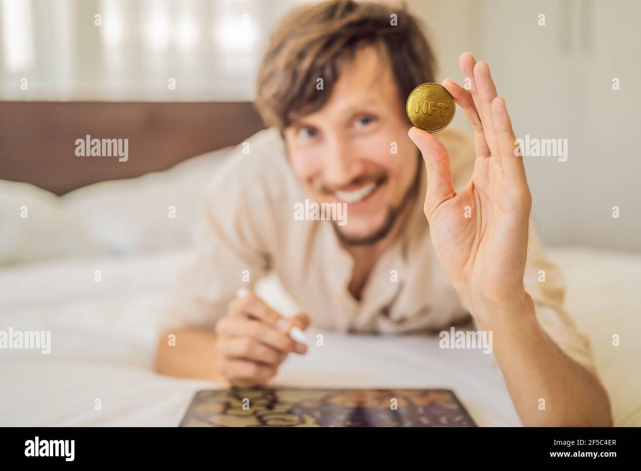 Young man, a digital artist, creates digital art on a tablet at home ... Young man, a digital artist, creates digital art on a tablet at home ...