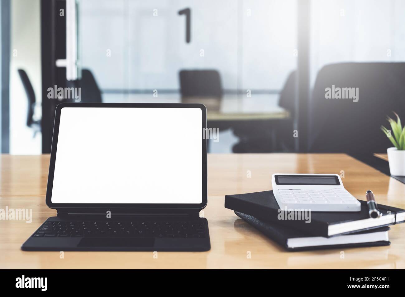 Digital tablet with blank screen on wooden desk Stock Photo - Alamy