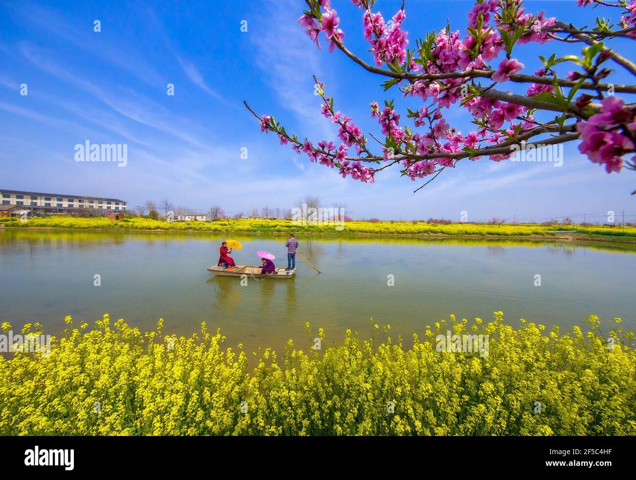 SUQIAN, CHINA - MARCH 25, 2021 - Tourists paddled on the water as ...