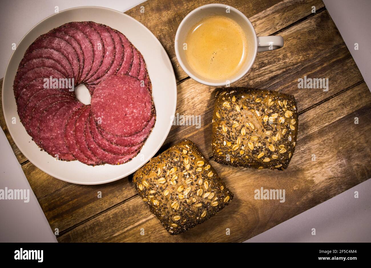 Breakfast table with rolls, coffee and sausage - top down view Stock ...