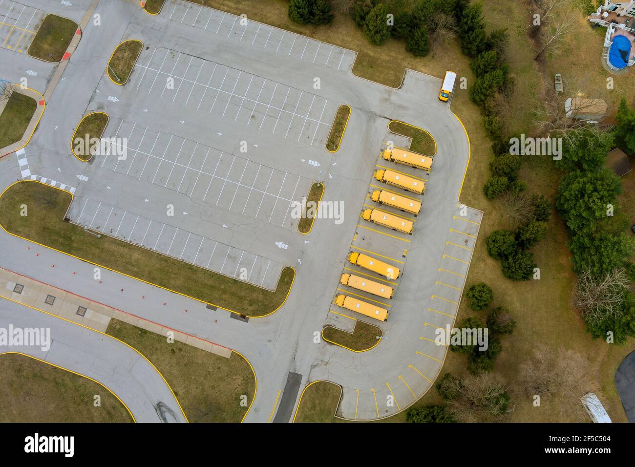 School buses in the school parking lot near the high school Stock Photo ...