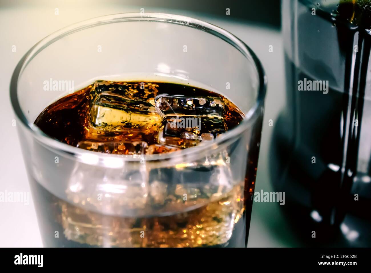 A glass of soda with ice cubes. Chilled drink in a glass Stock Photo ...