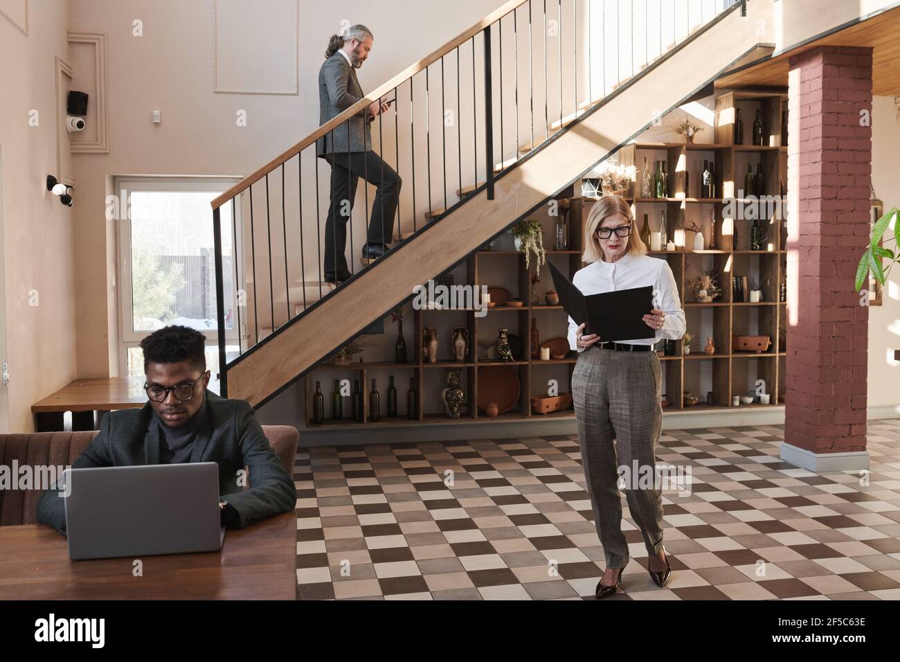 Business people doing their work in modern location Stock Photo - Alamy