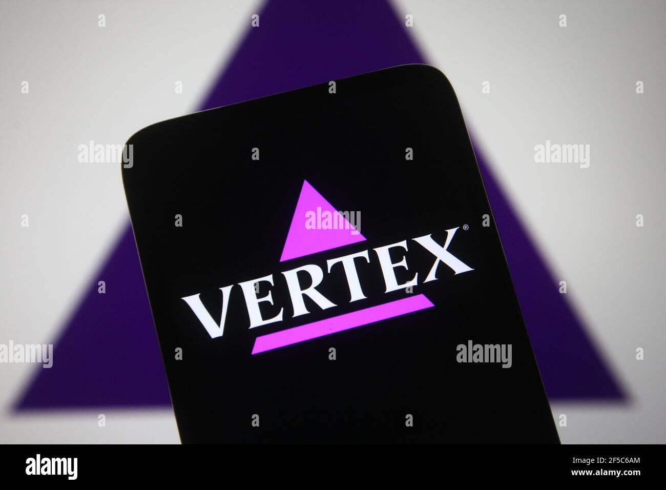 In this photo illustration the Vertex Pharmaceuticals logo is seen on a ...