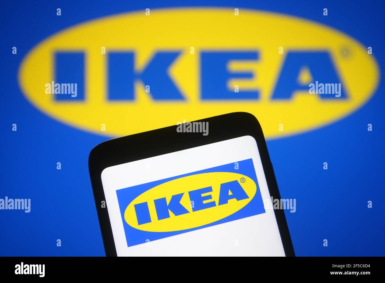 In this photo illustration the Ikea logo is seen on a smartphone and a pc screen. (Photo by ...