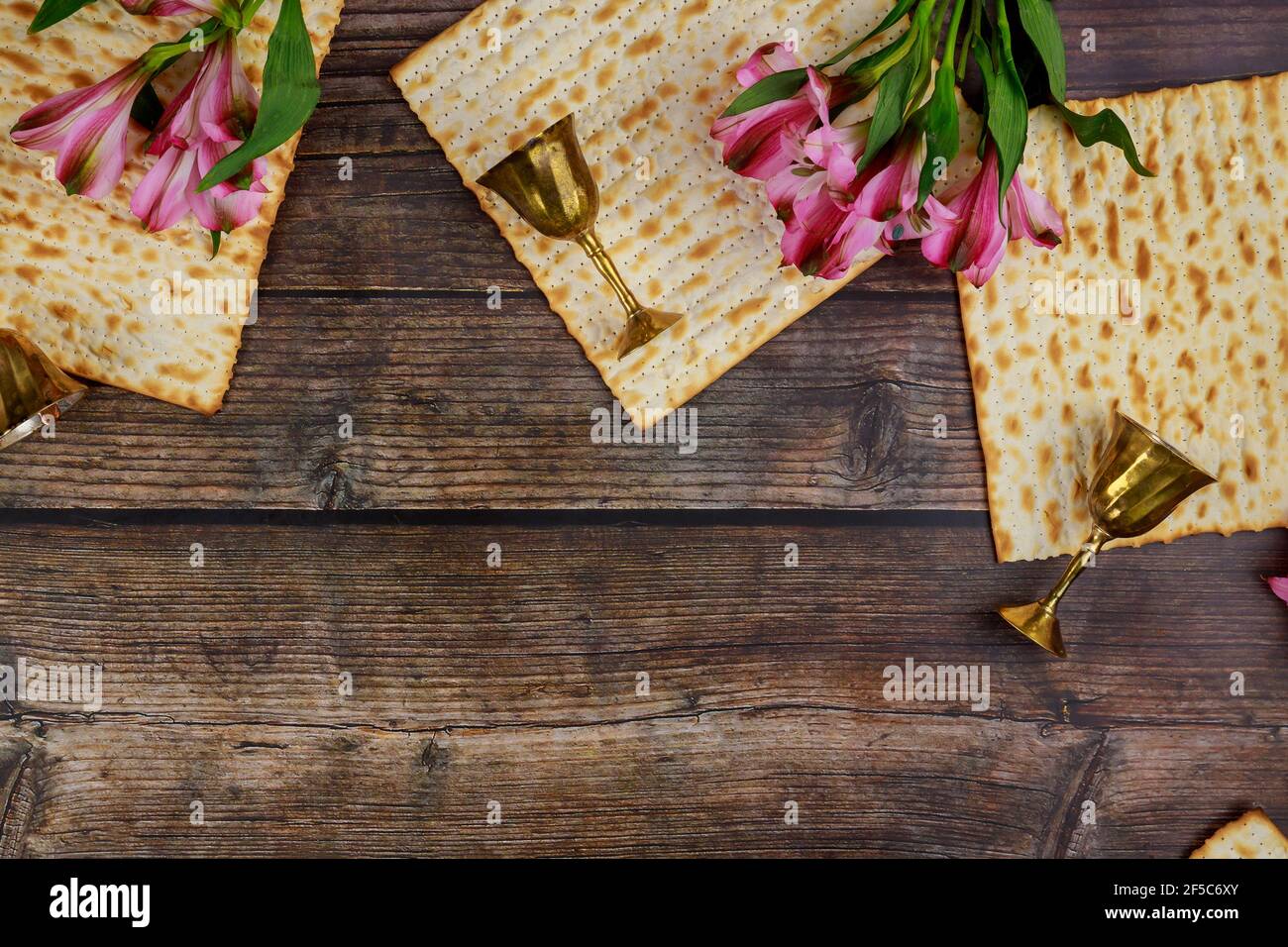 Jewish holiday table for Passover with matzah and cups for kosher wine ...