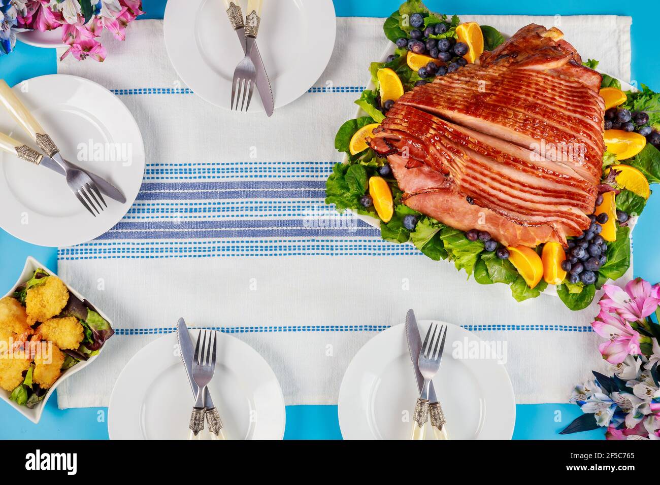 Hickory smoked sliced ham on festive table Stock Photo - Alamy