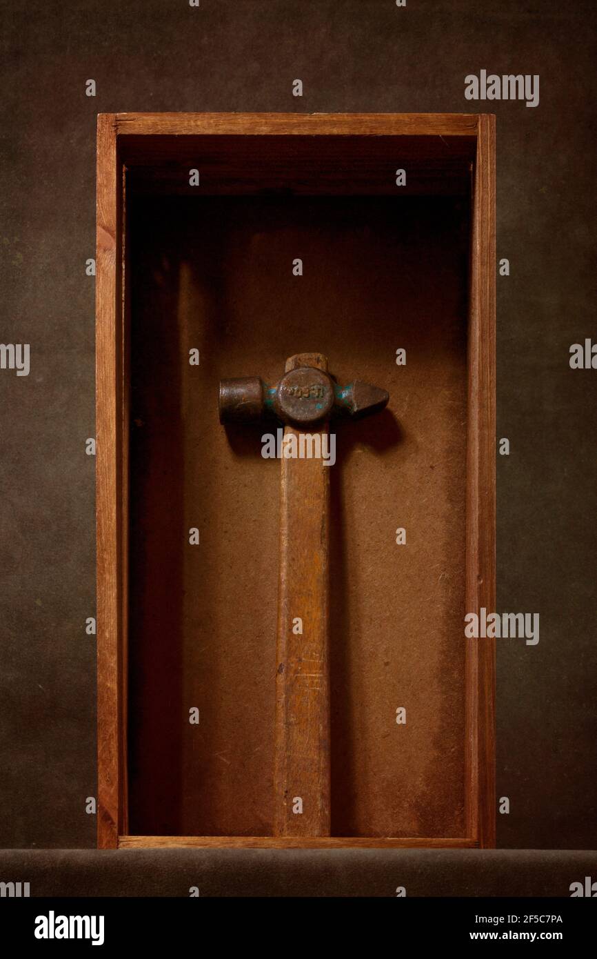 Still life with an old hammer in a wooden box Stock Photo - Alamy