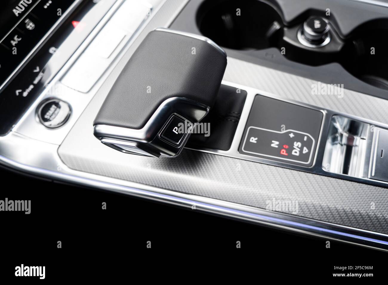 Automatic gear stick of a modern car. Modern car interior details ...