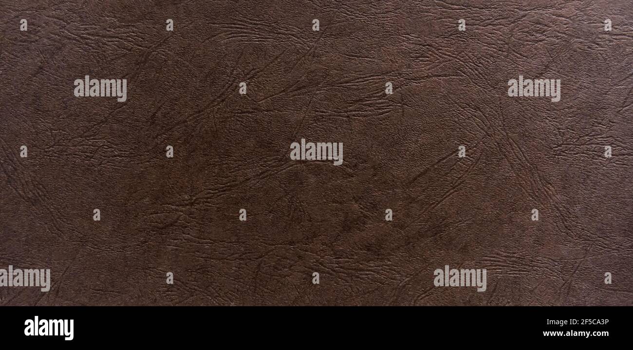 Abstract dark brown paper texture with leather-like embossing as ...
