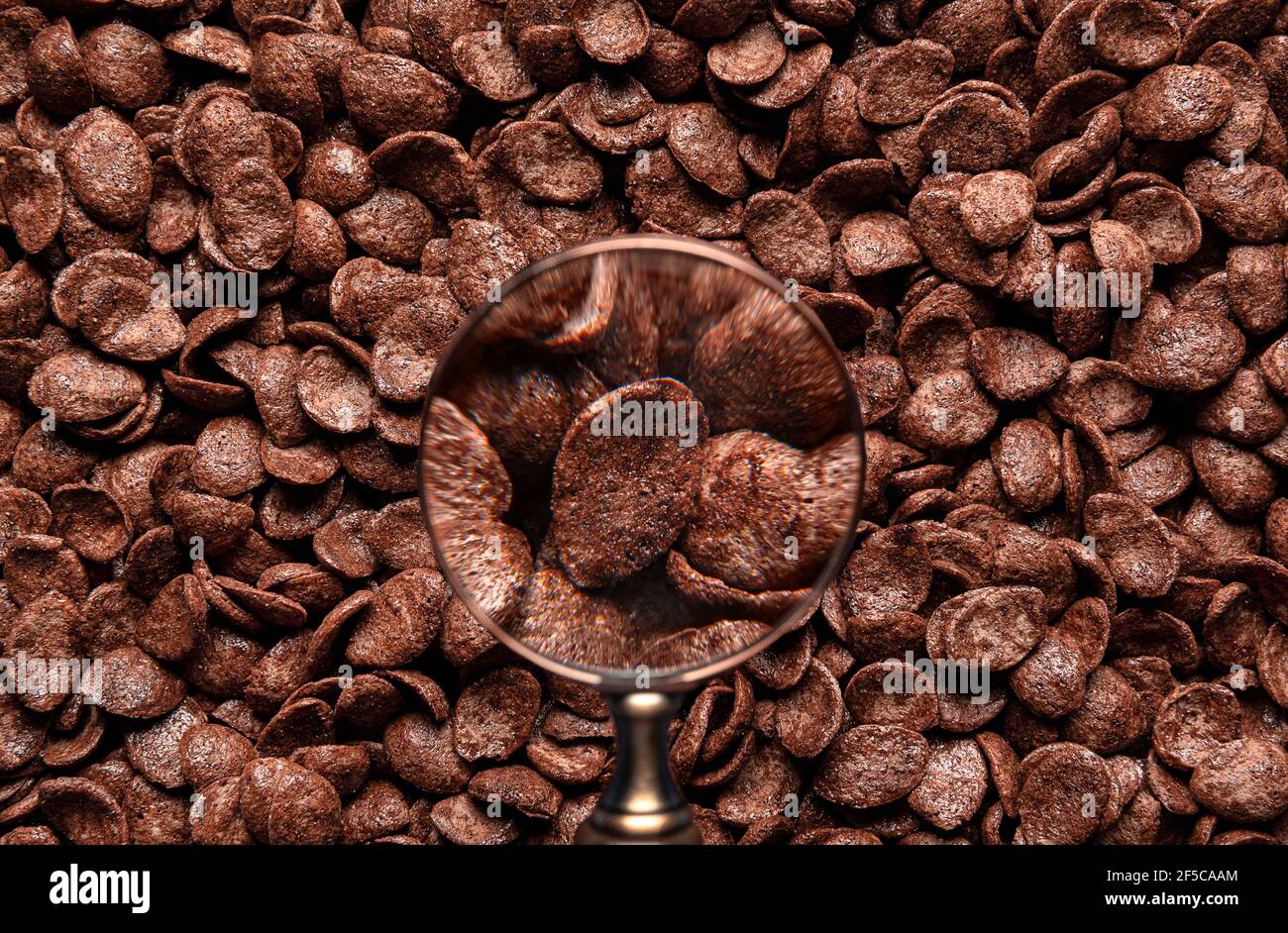 Chocolate cereals background. Breakfast cornflakes with cocoa, close-up ...
