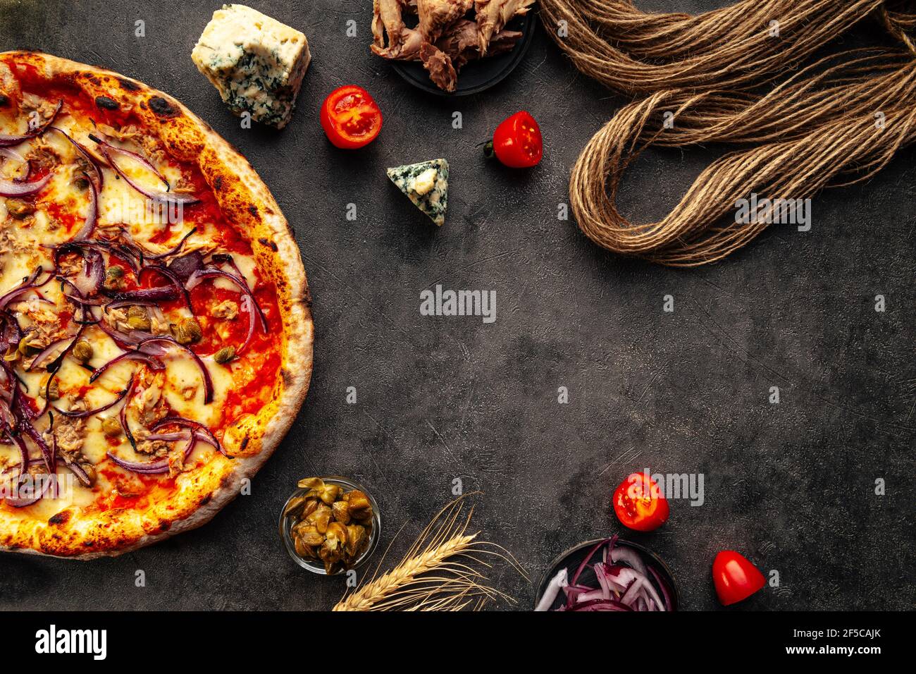 Baked onion pizza on the decorated background Stock Photo - Alamy