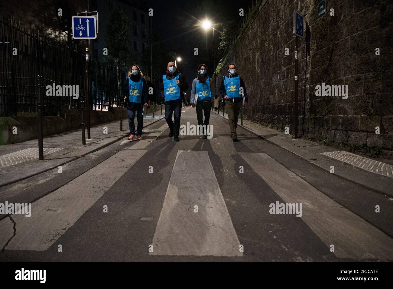 Volunteers walk during the night of solidarity (nuit des solidarites ...