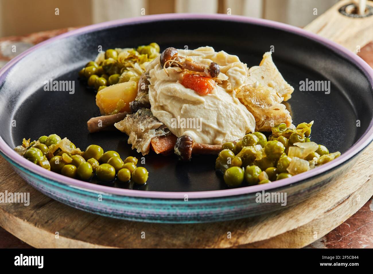 Fish stew made from shiitake mushrooms palamida and green peas Stock ...