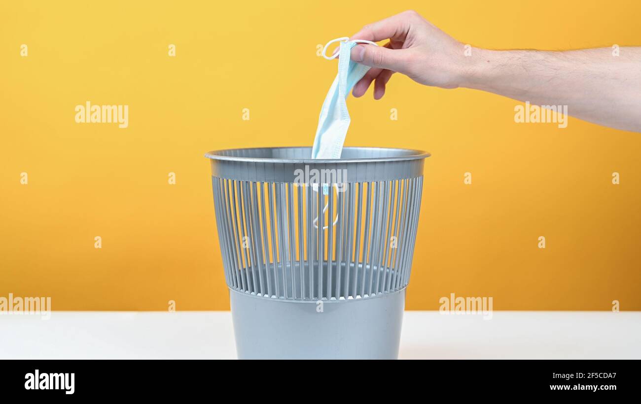 The face mask is thrown into the trash. High quality photo Stock Photo ...