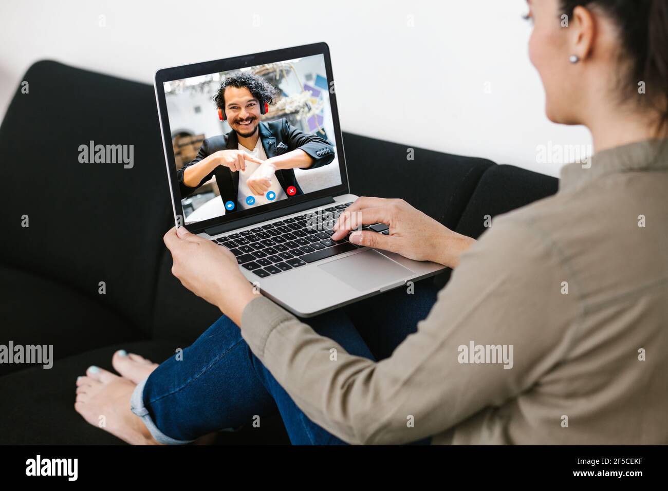 Back view of business latin woman talking to her mexican colleagues in ...
