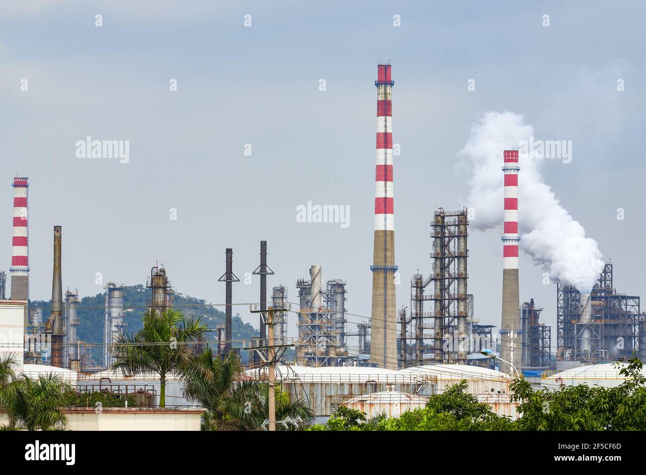 Plant equipment and chimney pipes of large oil refineries Stock Photo - Alamy