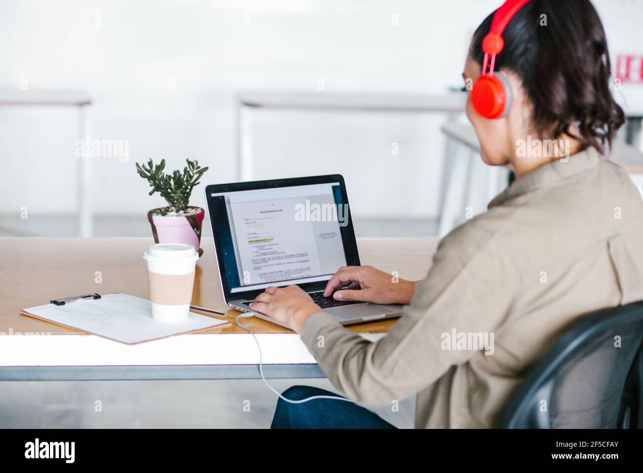 latin woman working with computer at office in Mexico city Stock Photo ...