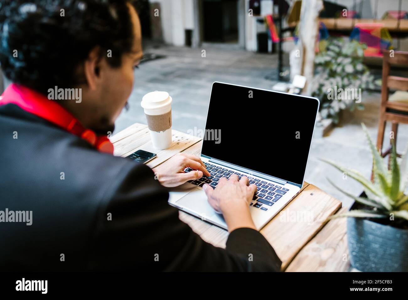 latin man working with computer at office in Mexico city Stock Photo ...