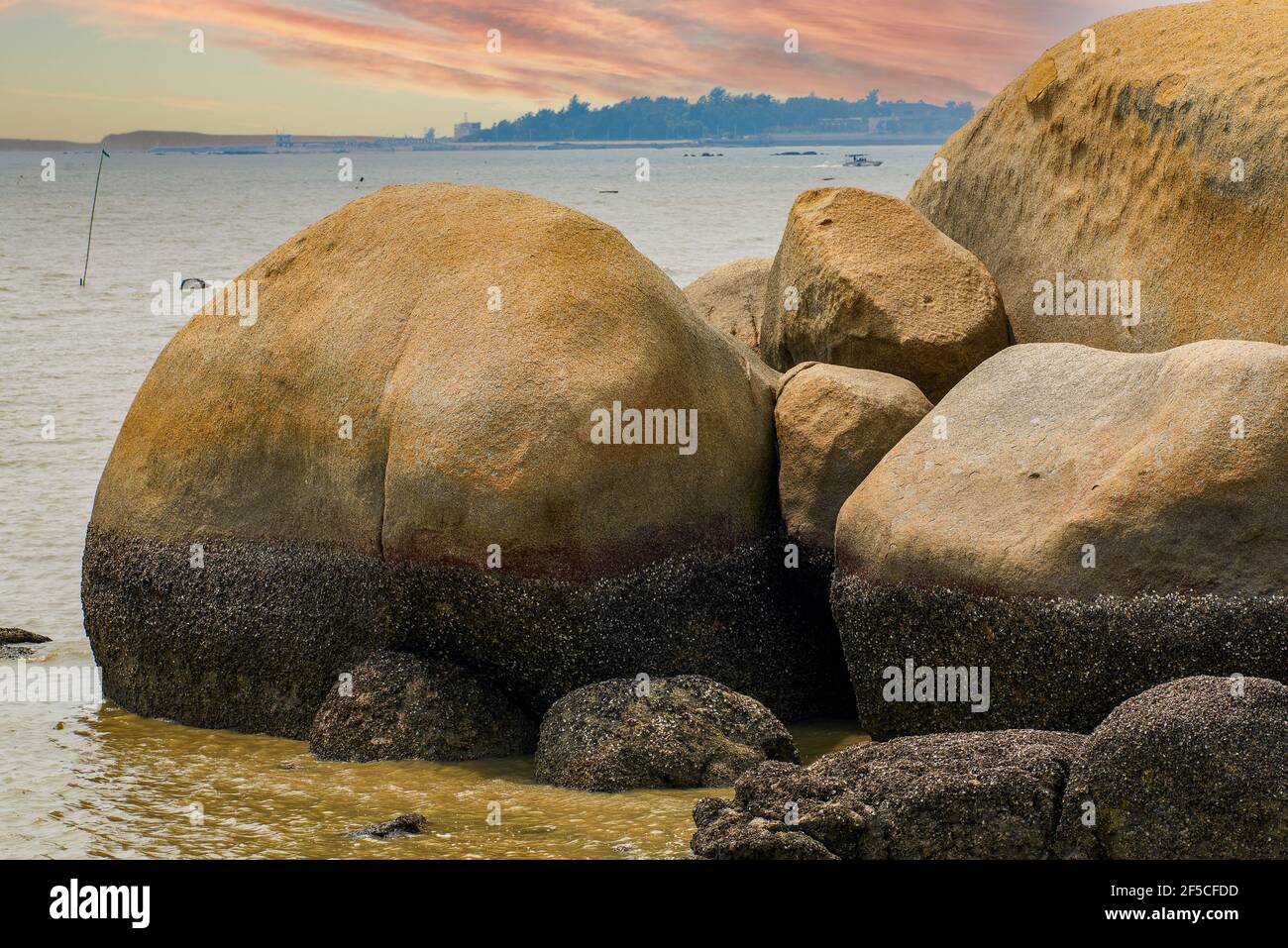 Crushed stones and huge rocks on the beach Stock Photo - Alamy