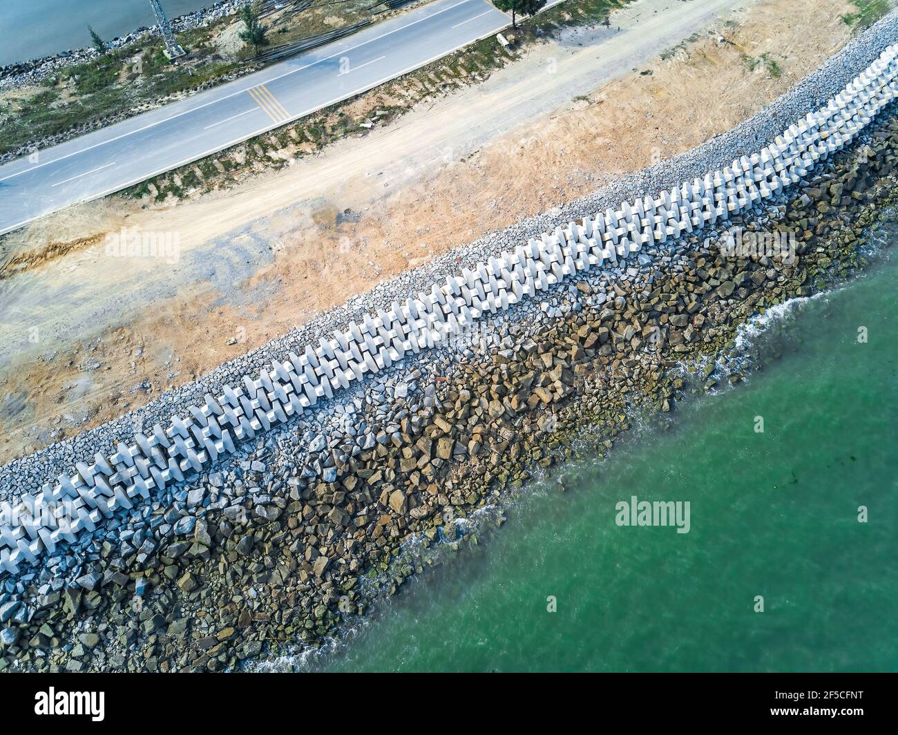 Cement block breakwater of coastal highway, aerial photography of ...