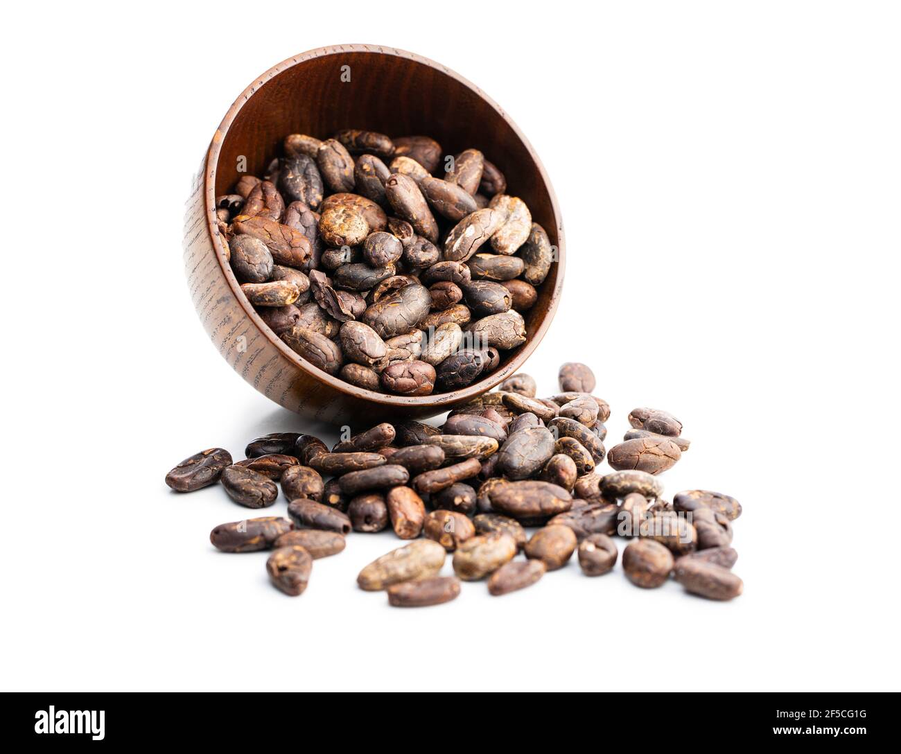 Roasted cocoa beans in bowl isolated on white background Stock Photo ...