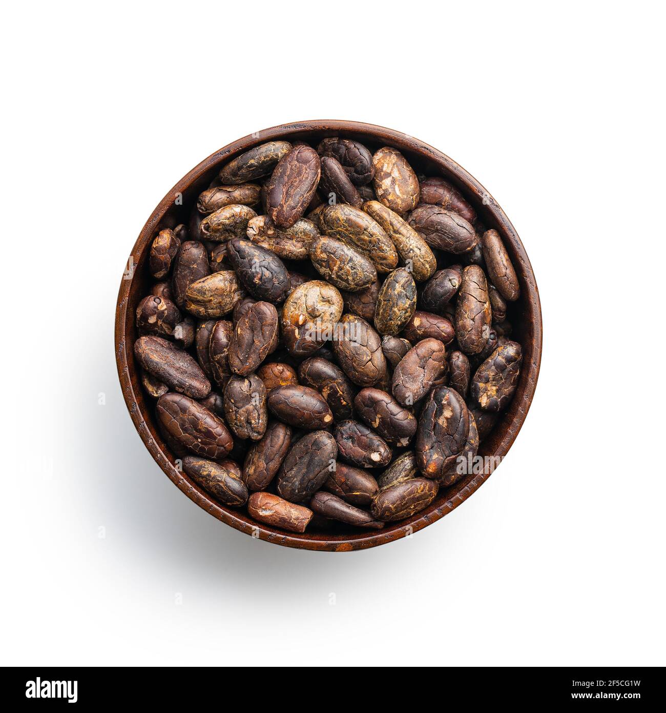 Roasted cocoa beans in bowl isolated on white background Stock Photo ...