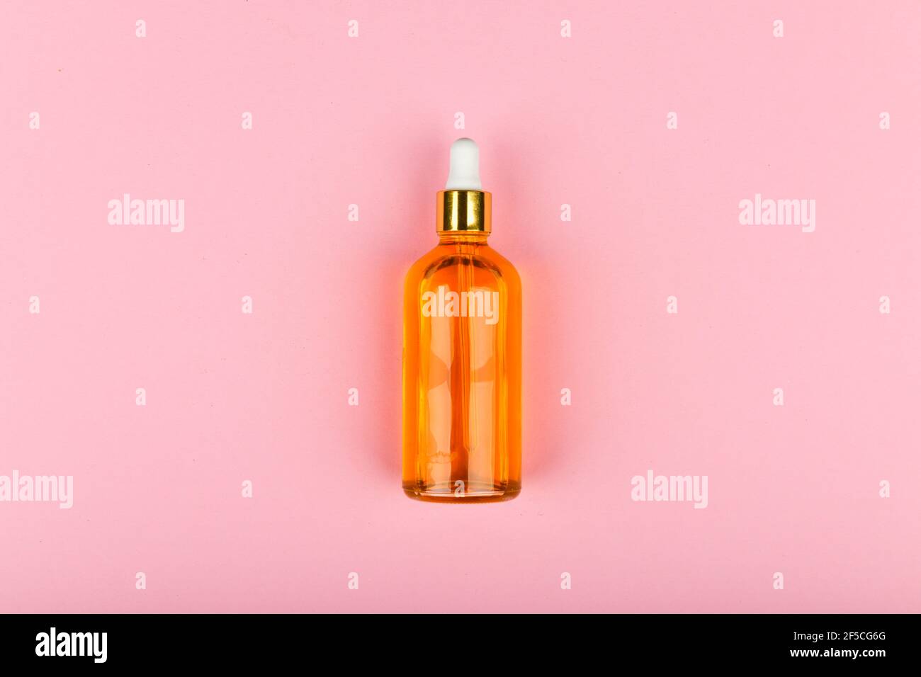 effective can of oil on a pink background. Eco care concept. Skin care ...