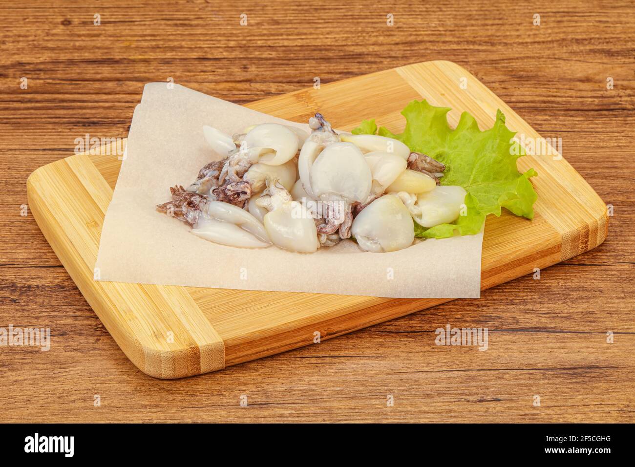 Raw seafood - cuttlefish for cooking over board Stock Photo - Alamy
