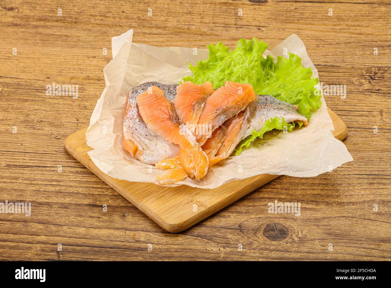 Sliced natural wild trout fillet over board Stock Photo - Alamy