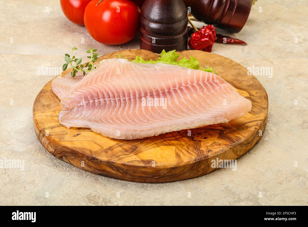 Raw tilapia fish fillet for cooking Stock Photo - Alamy